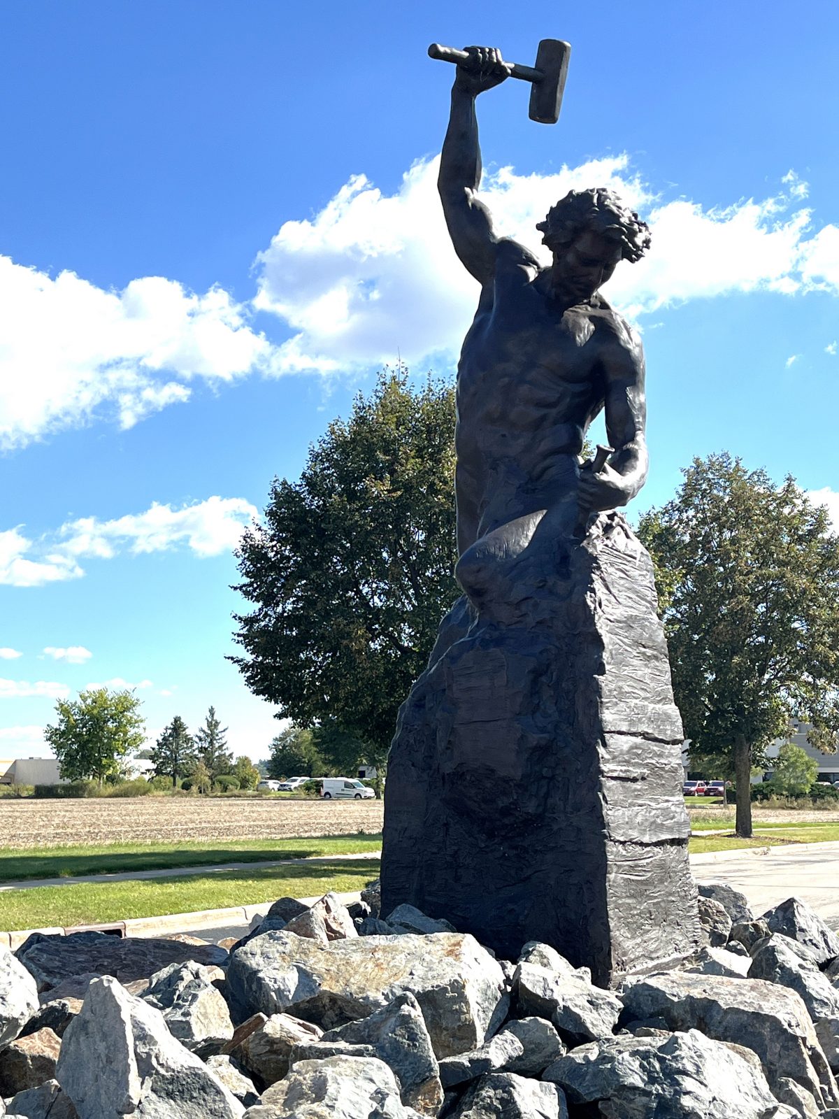 Stop 20 - Self-made Man bronze statue - Visit Middleton